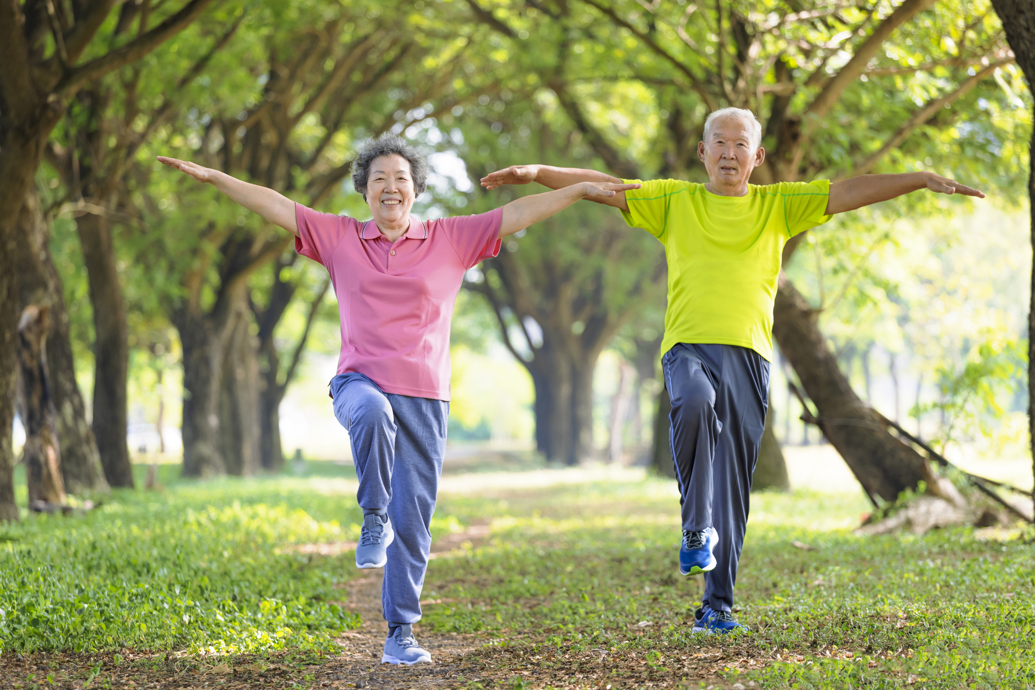 Happy senior couple exercising in the park | Springpoint